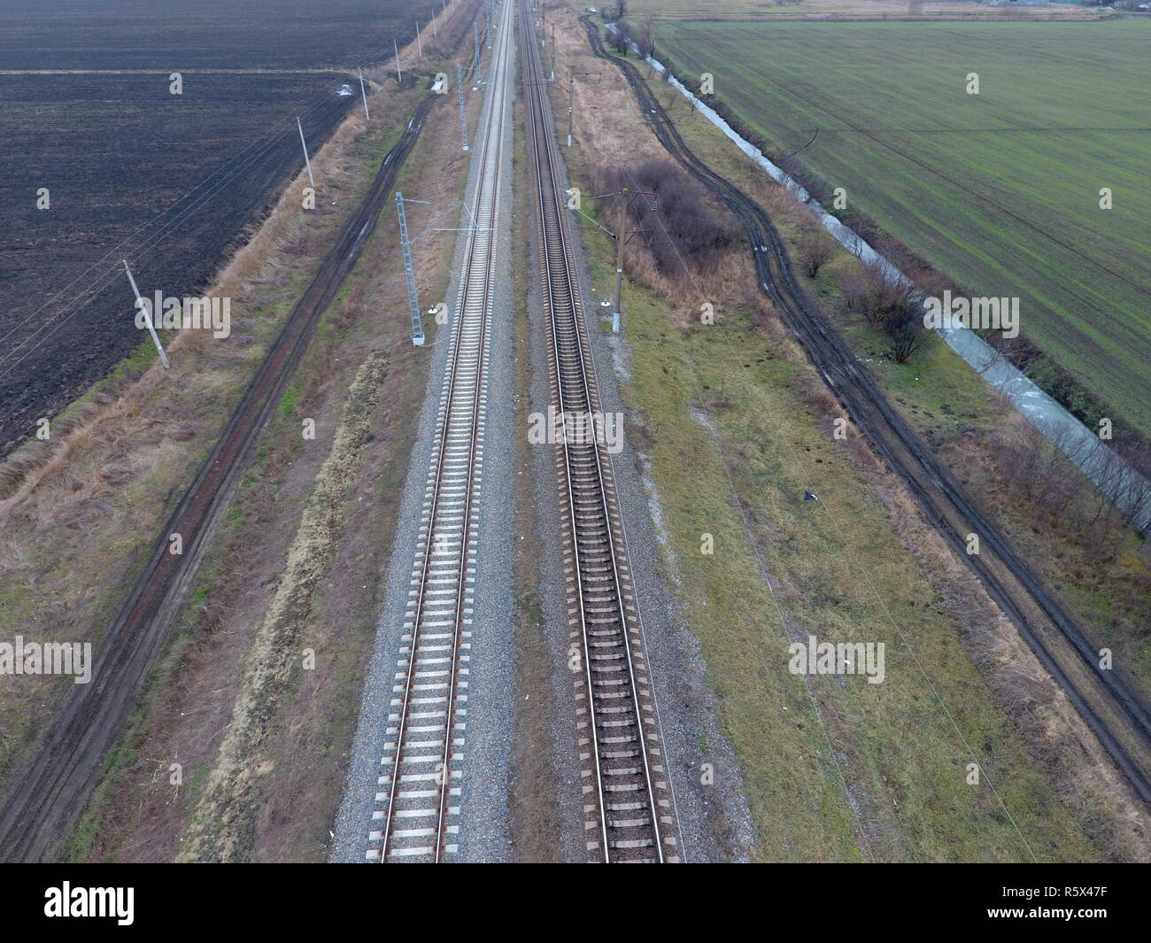 Plot railway. Top view on the rails. High-voltage power lines for ...