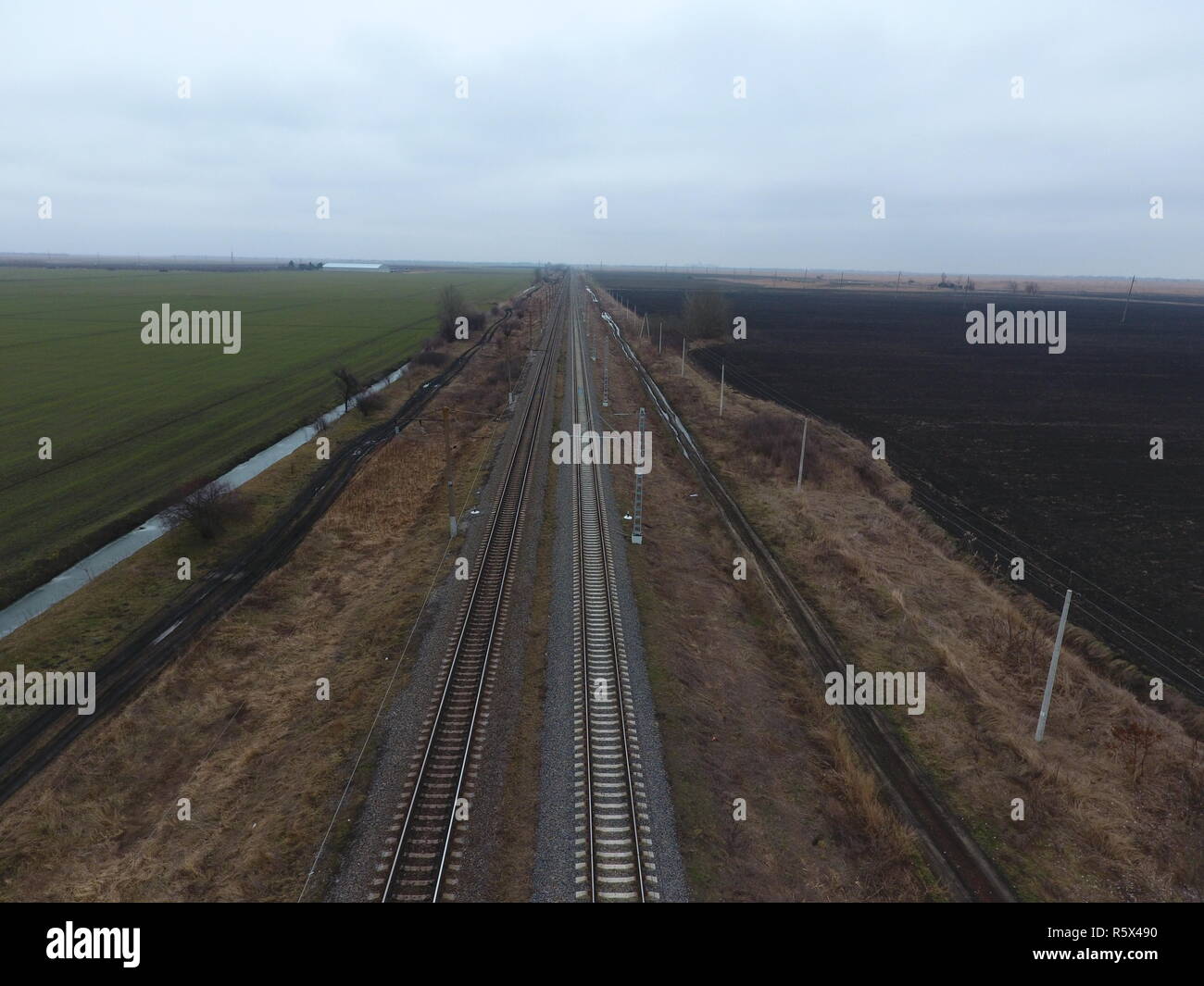 Plot railway. Top view on the rails. High-voltage power lines for ...