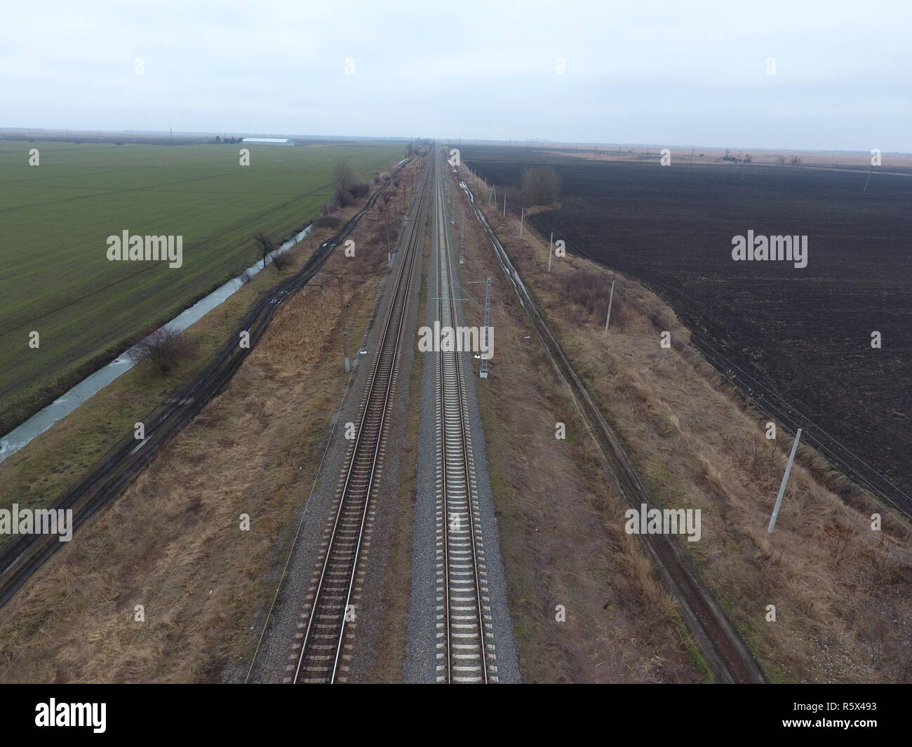 Plot railway. Top view on the rails. High-voltage power lines for ...