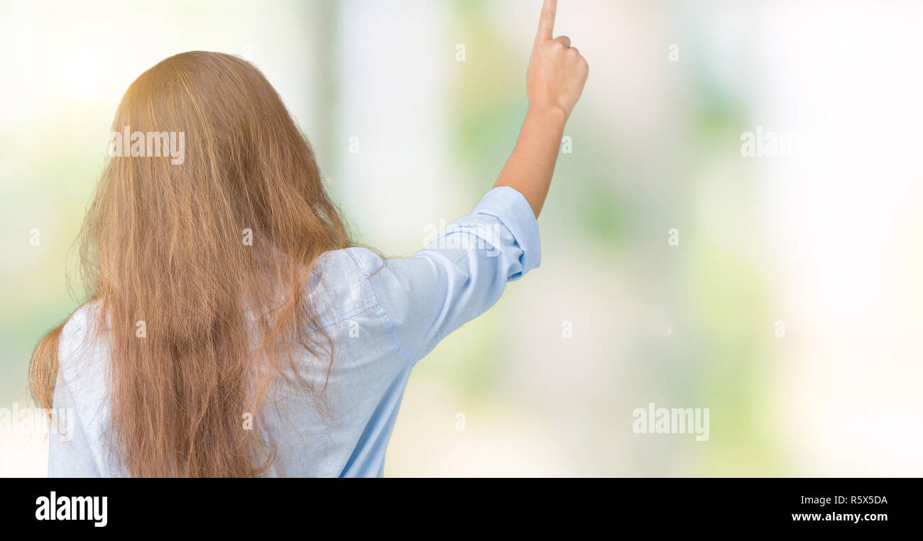 Young beautiful brunette business woman over isolated background Posing ...