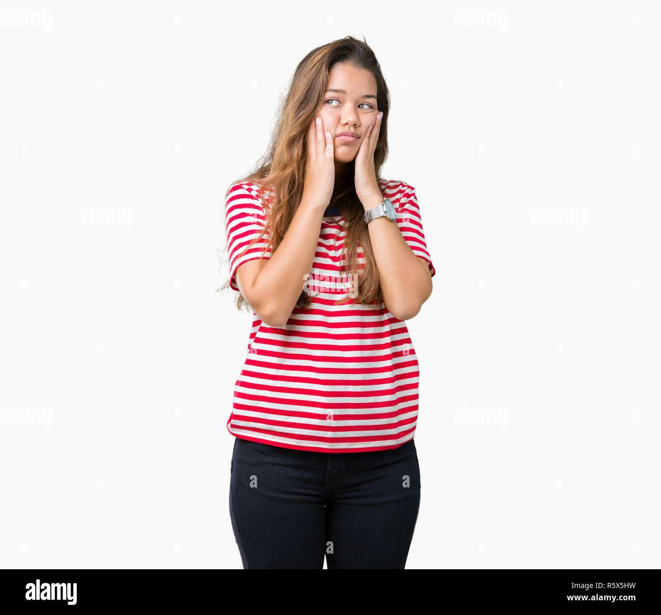 Young beautiful brunette woman wearing stripes t-shirt over isolated ...