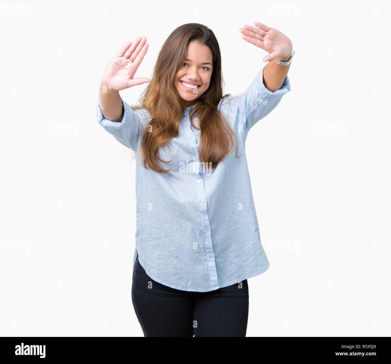 Young beautiful brunette business woman over isolated background ...