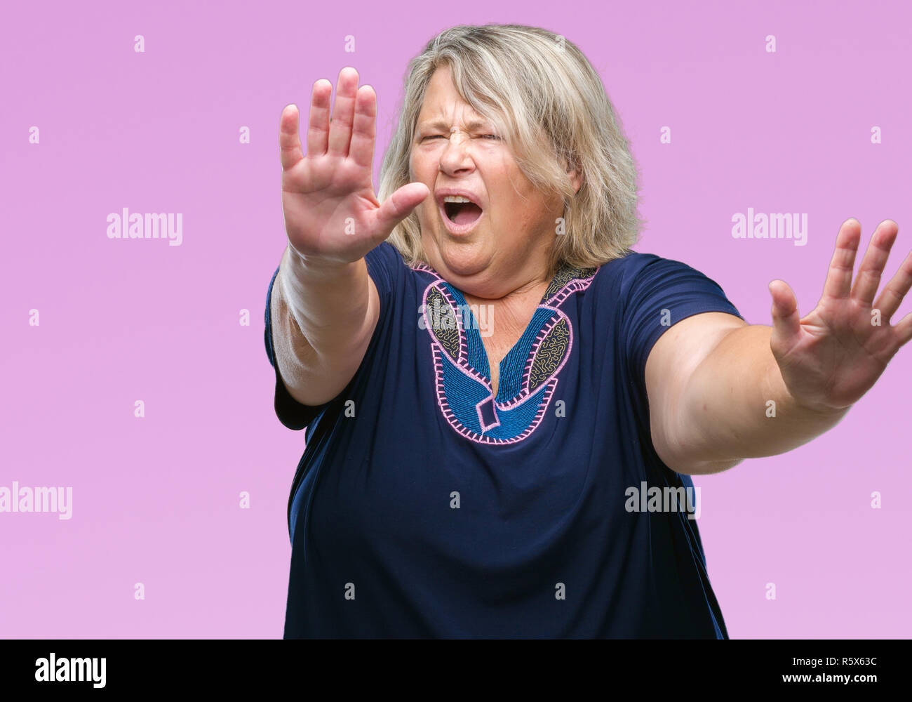Senior plus size caucasian woman over isolated background afraid and ...