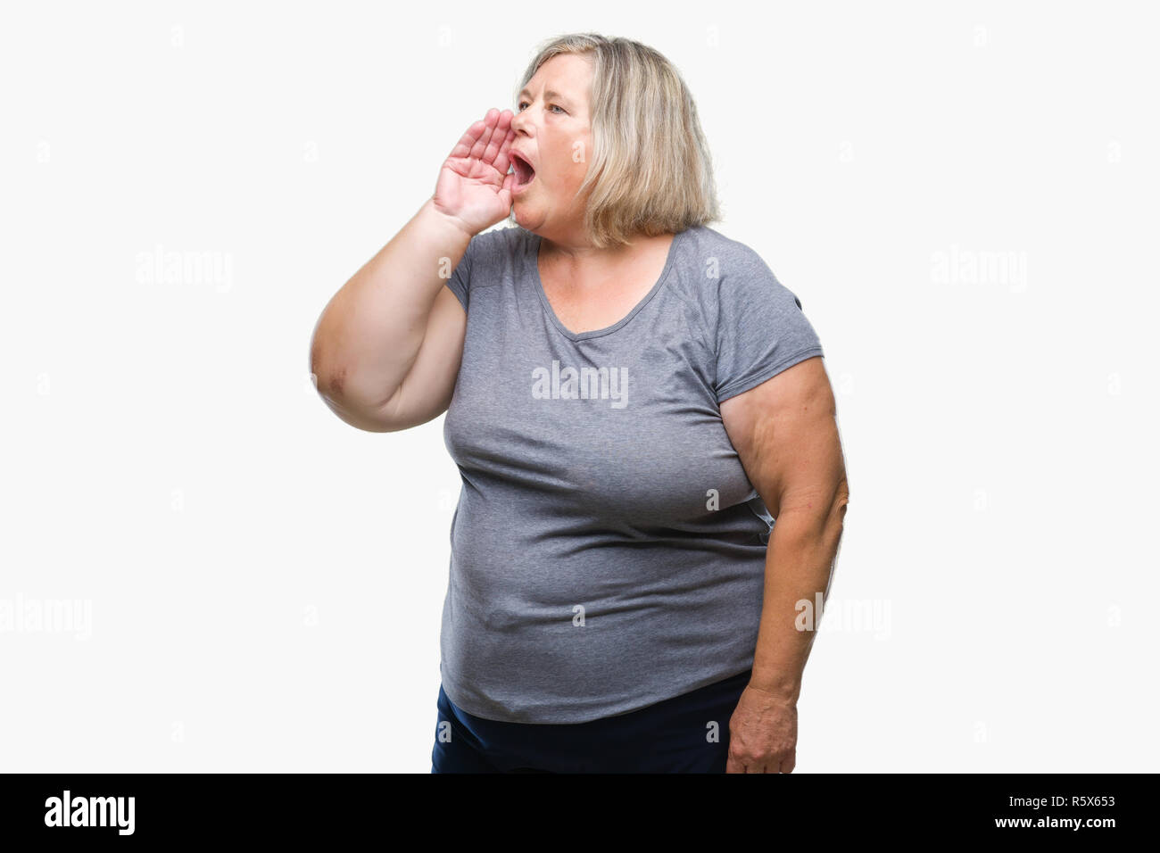 Senior plus size caucasian woman over isolated background shouting and ...