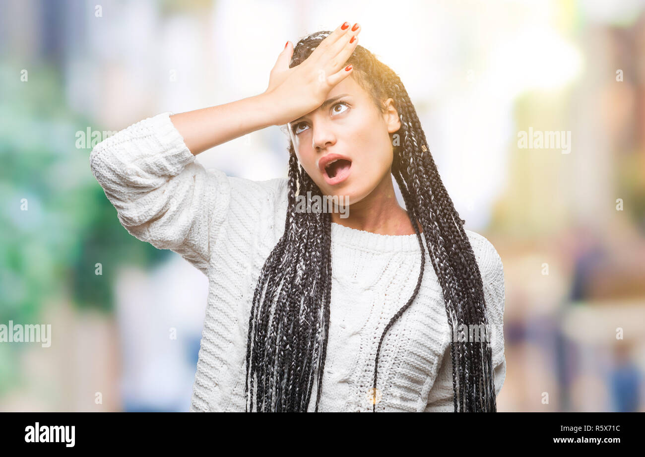 Young braided hair african american girl wearing sweater over isolated ...
