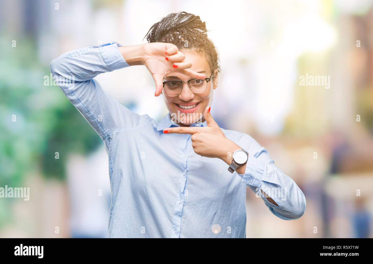 Young braided hair african american business girl wearing glasses over ...