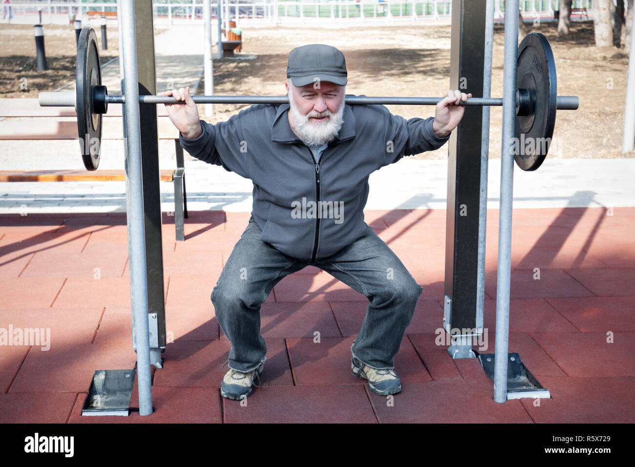 Elder person doing physical exercise hi-res stock photography and ...