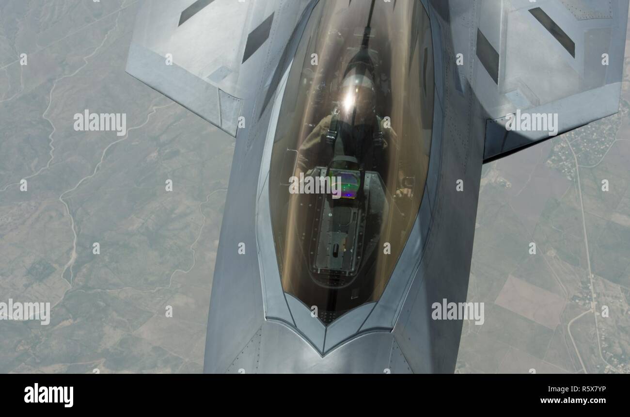A U.S. Air Force F-22 Raptor pilot maneuvers his plane into position ...