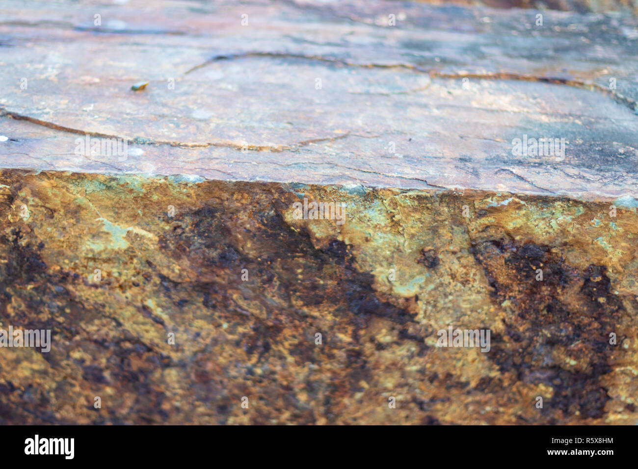Iron ore mineral rich cut ornamental stone with cracks Stock Photo - Alamy