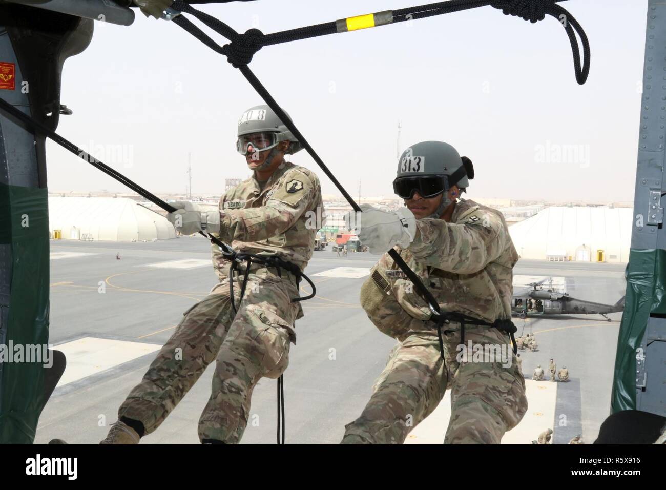 U.S. Army Spc. Melendez Casado (left), horizontal construction engineer ...