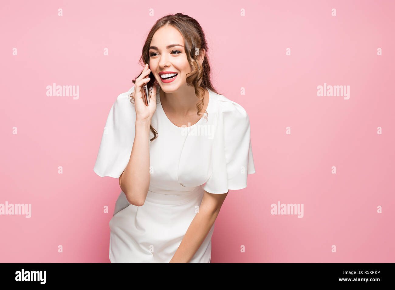 Happy woman phone talking. Face with toothy smile Stock Photo - Alamy