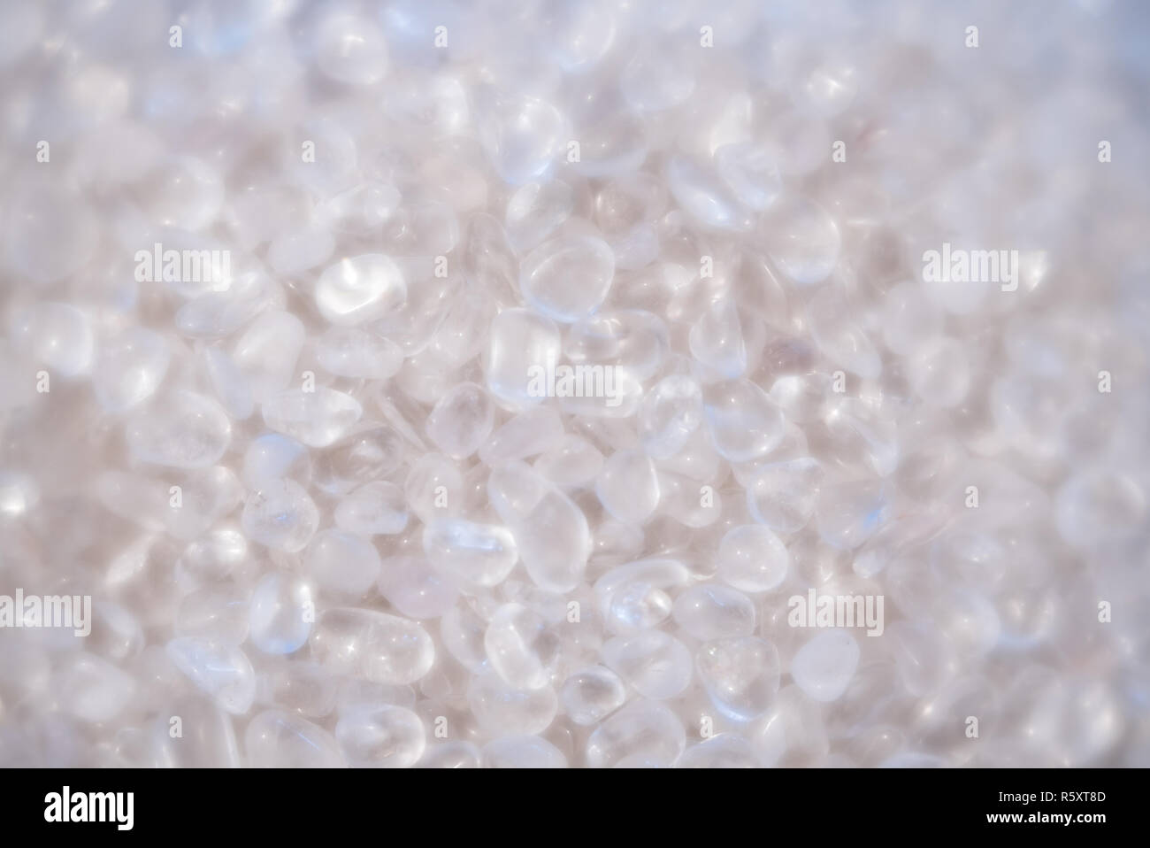 horizontal background of small polished quartz and rock crystal stones ...