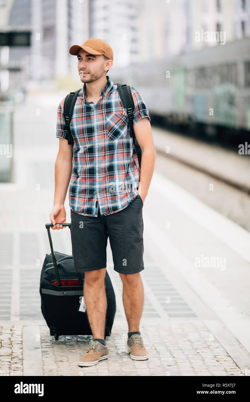 Traveler is late at the train station. Young man with backpack missed ...