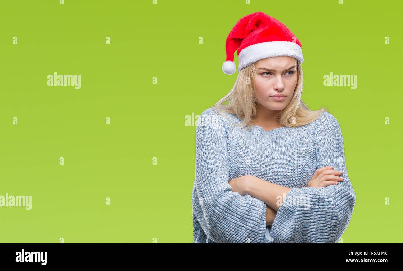 Young caucasian woman wearing christmas hat over isolated background ...