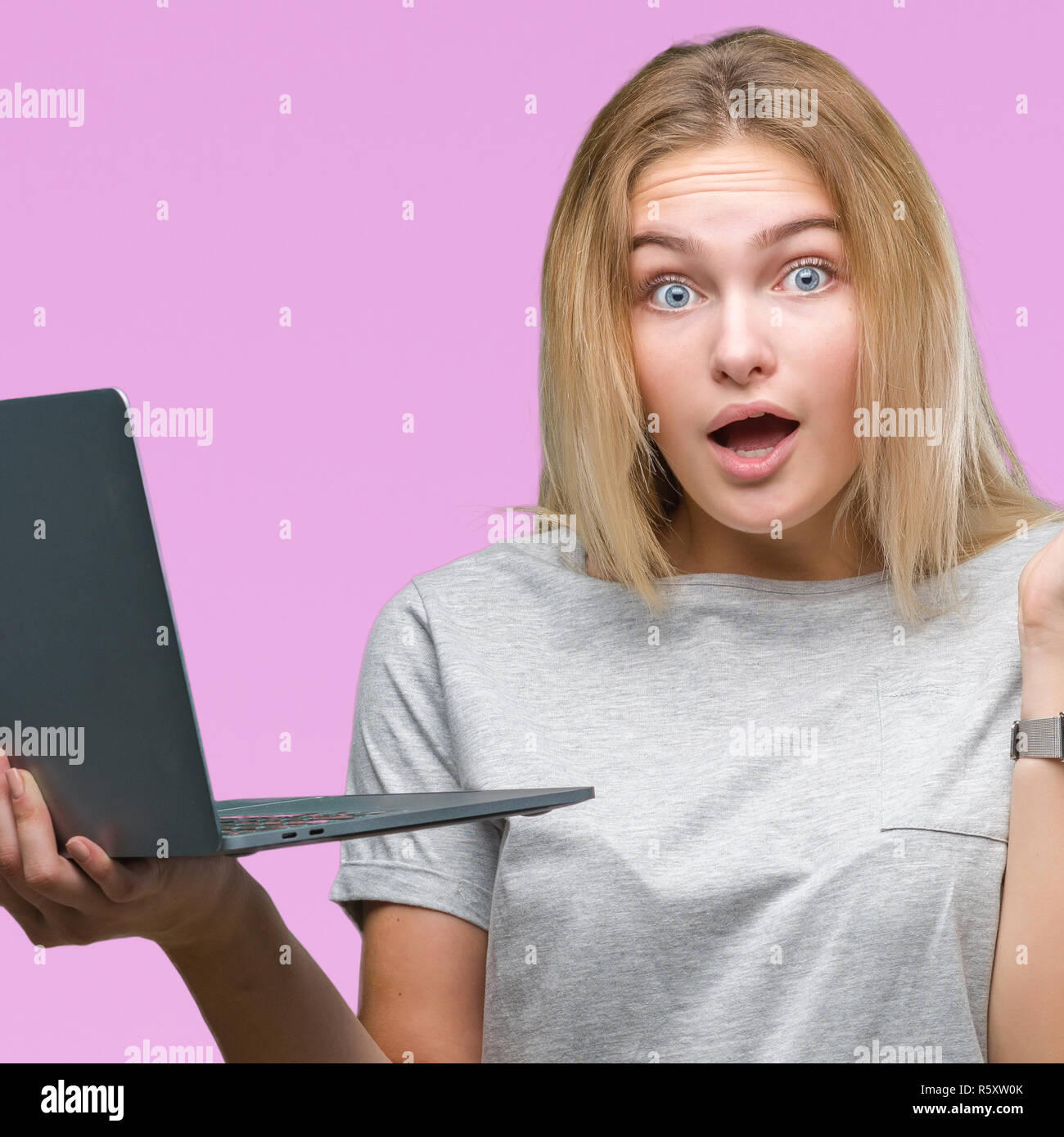 Young caucasian woman using computer laptop over isolated background ...