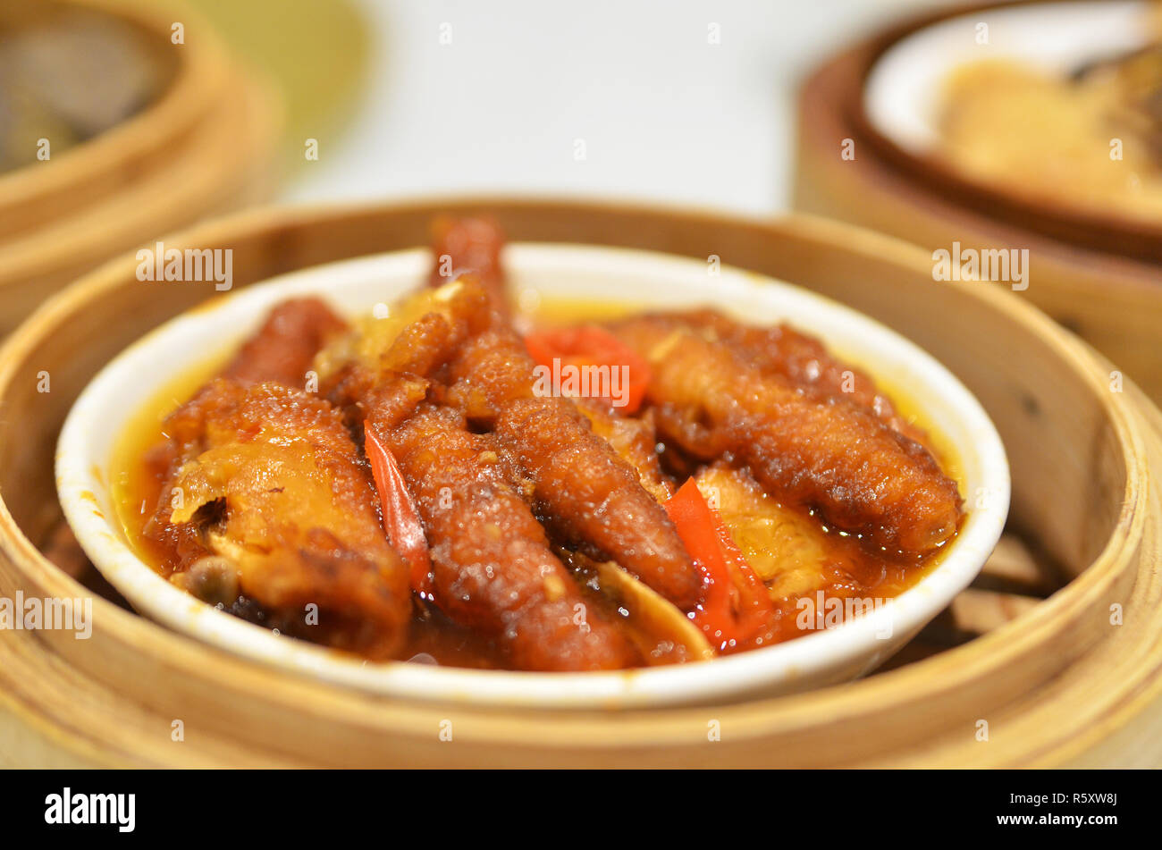 Steamed chicken feet dim sum Stock Photo - Alamy