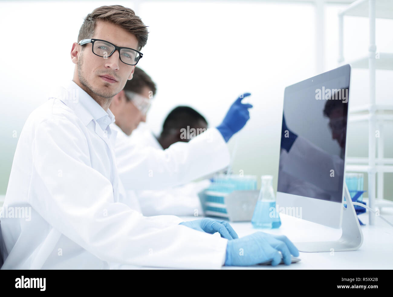 Young scientist sitting in hi-res stock photography and images - Alamy
