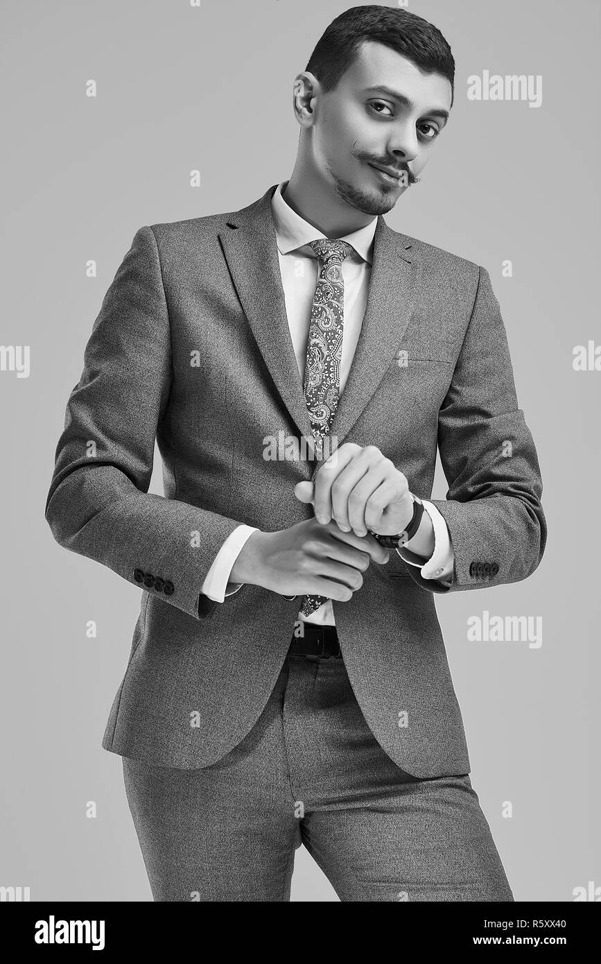 Portrait of handsome young confident arabic businessman with fancy ...