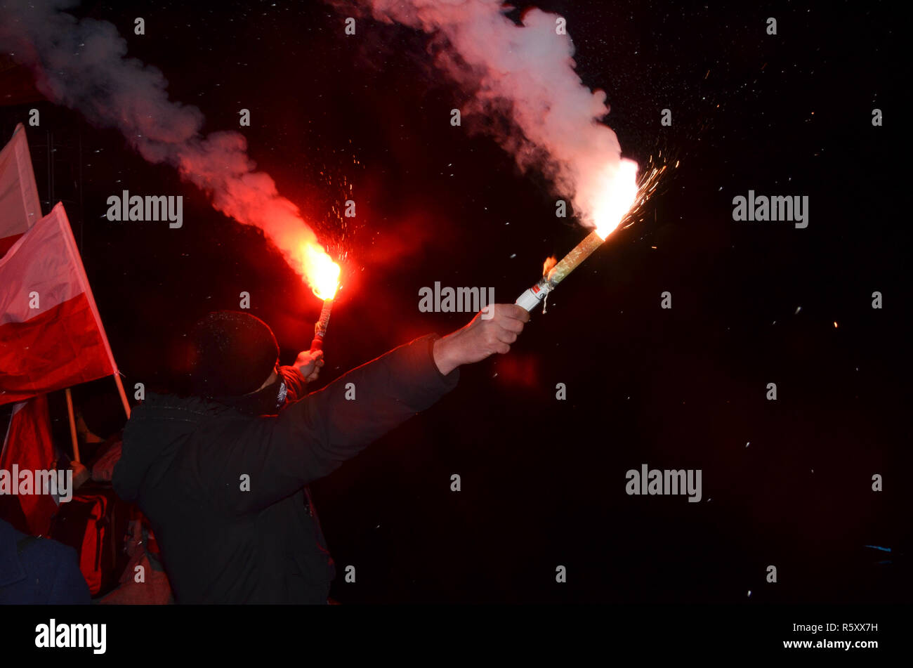 A man holds flares on Poniatowski Bridge, Polish National Independence ...
