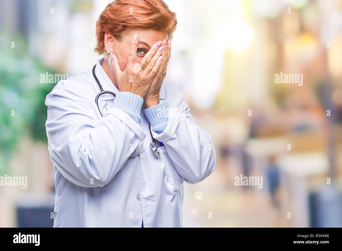 Senior caucasian doctor woman wearing medical uniform over isolated ...