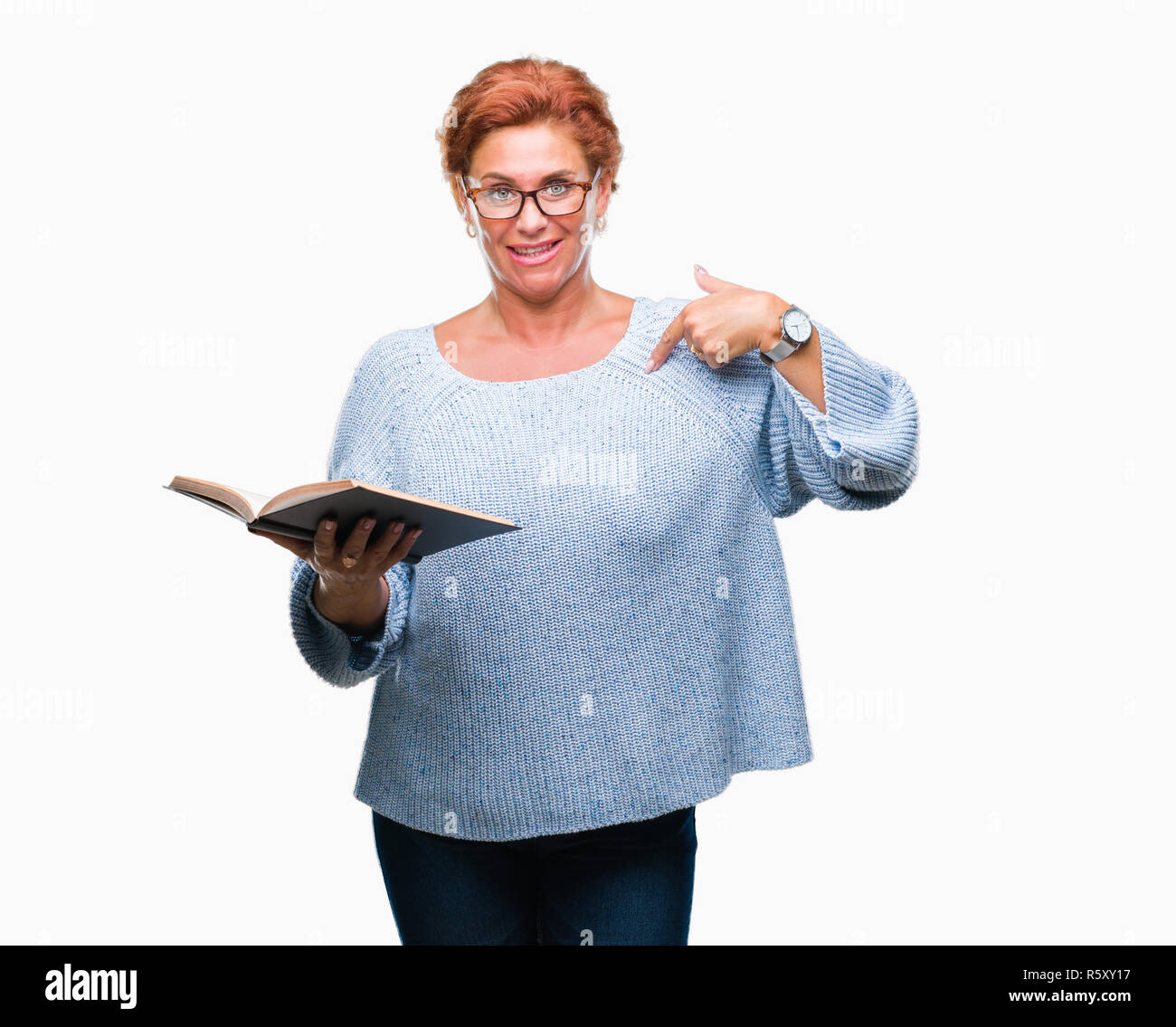 Senior caucasian woman reading a book over isolated background with ...