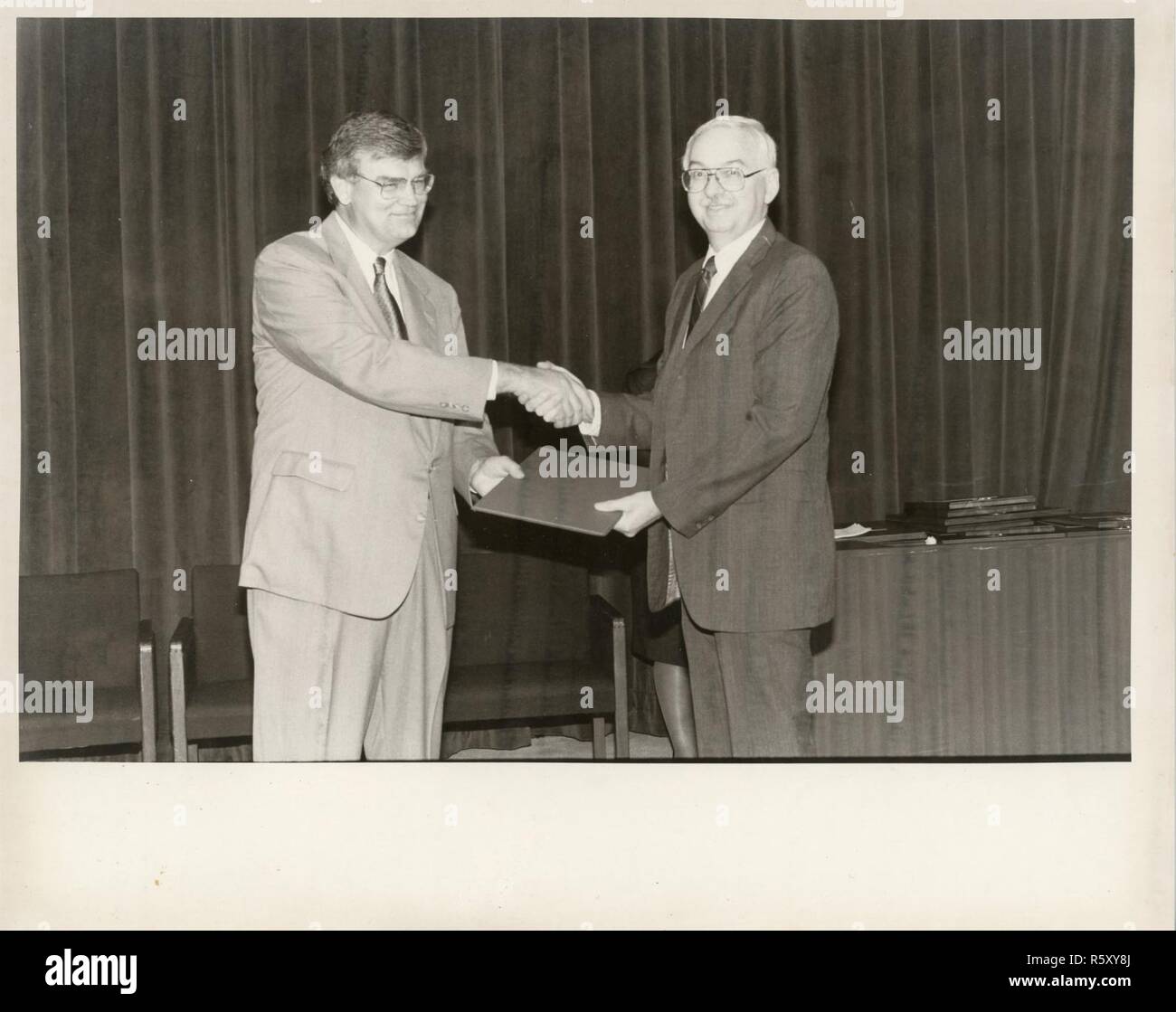 Admin. Atwood presenting general awards - Man receiving award on stage ...