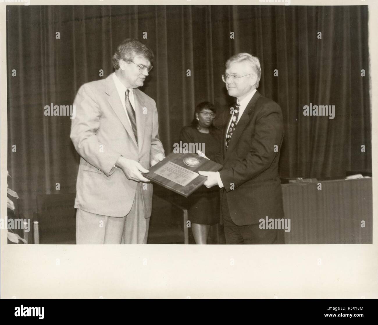 Admin. Atwood presenting general awards - Man receiving award on stage ...