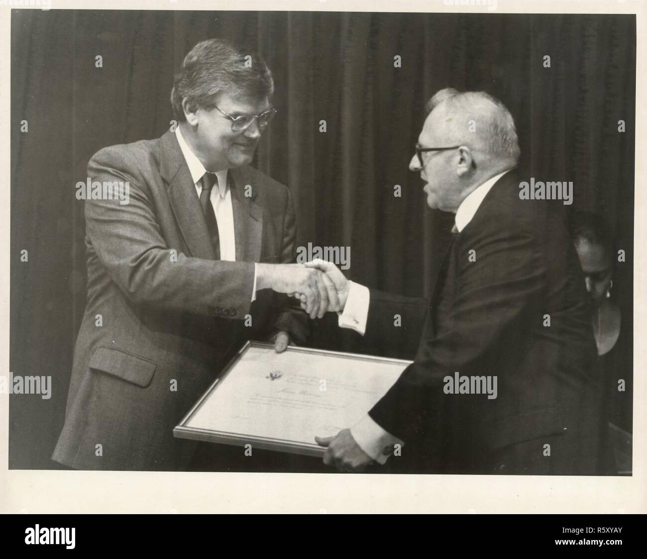 Admin. Atwood presenting general awards - Man receiving award on stage ...