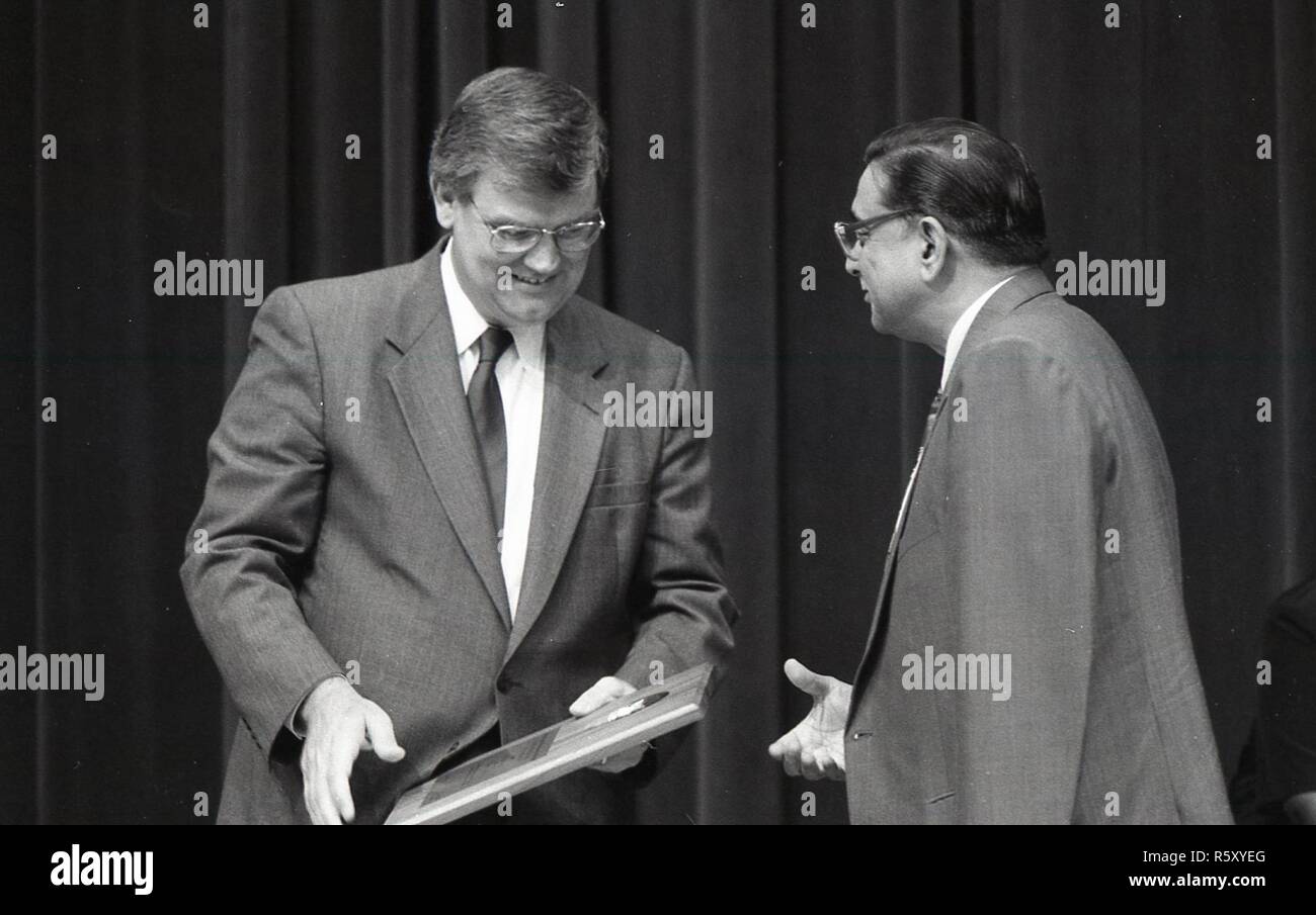 Admin. Atwood presenting general awards - Man receiving award on stage ...