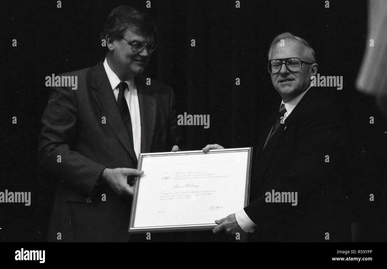 Admin. Atwood presenting general awards - Man receiving award on stage ...