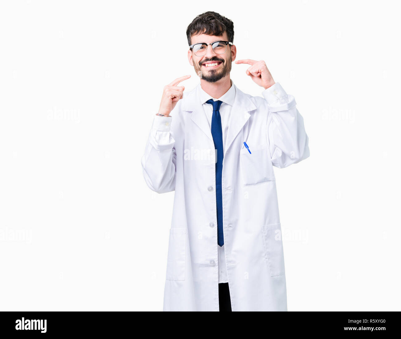 Young professional scientist man wearing white coat over isolated ...