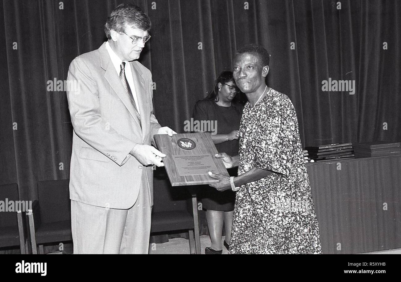 Admin. Atwood presenting general awards - Man receiving award on stage ...