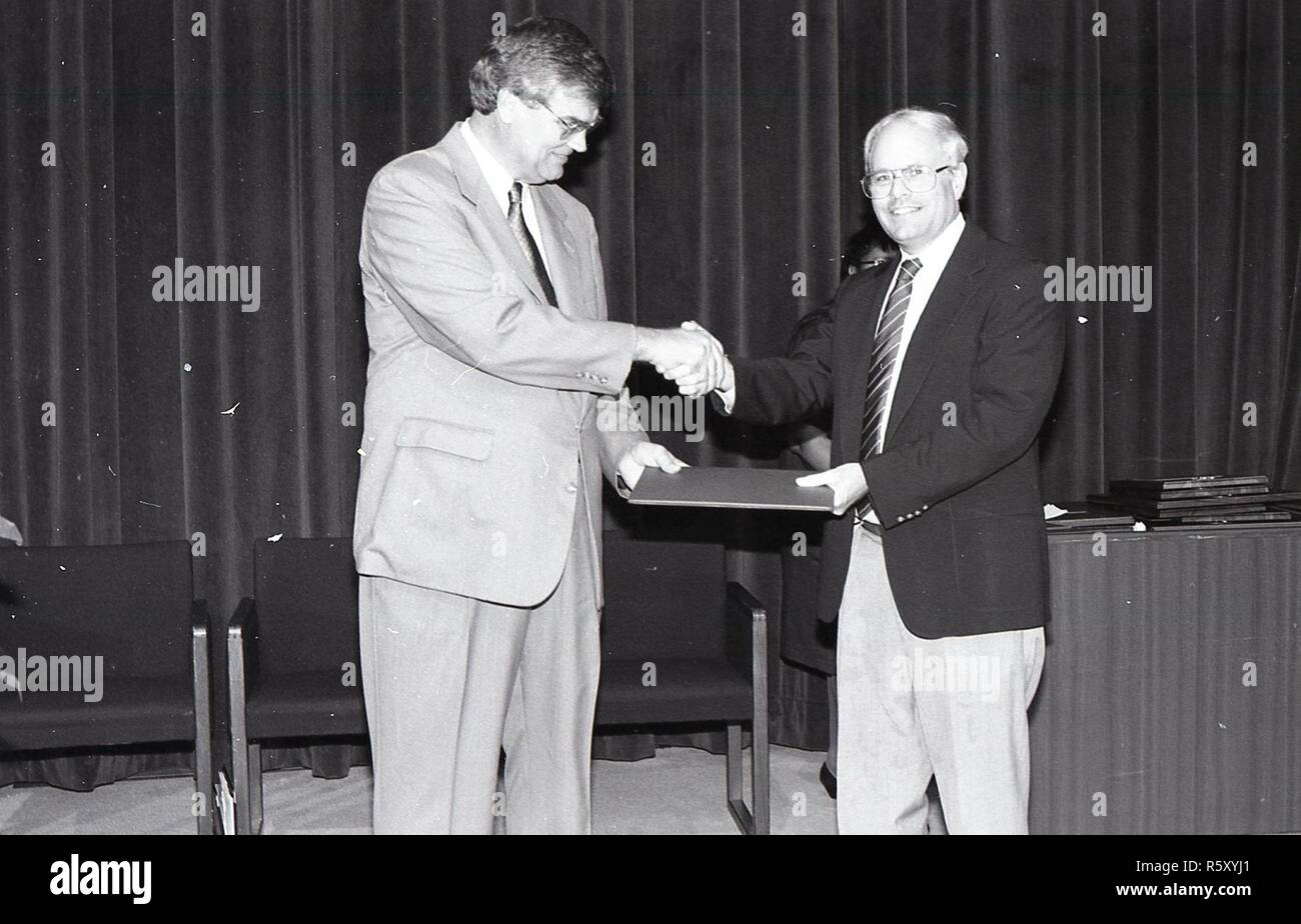 Admin. Atwood presenting general awards - Man receiving award Stock ...