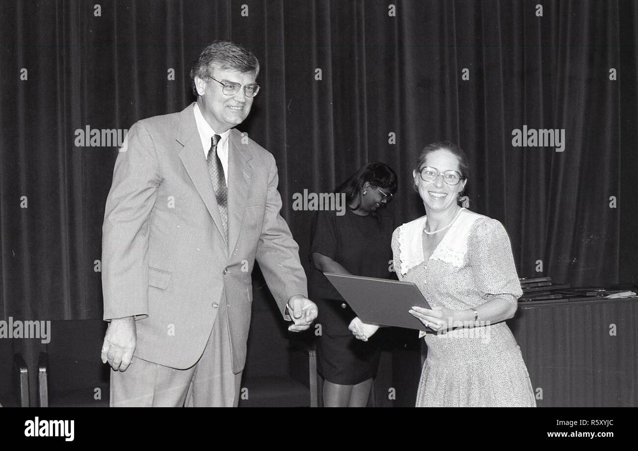 Admin. Atwood presenting general awards - Woman receiving award on ...