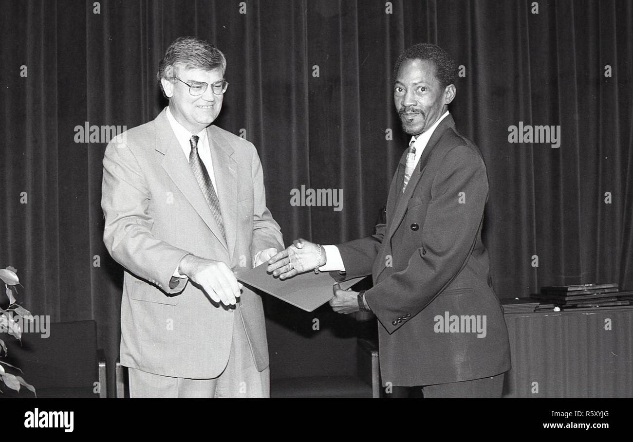 Admin. Atwood presenting general awards - Man receiving award on stage ...