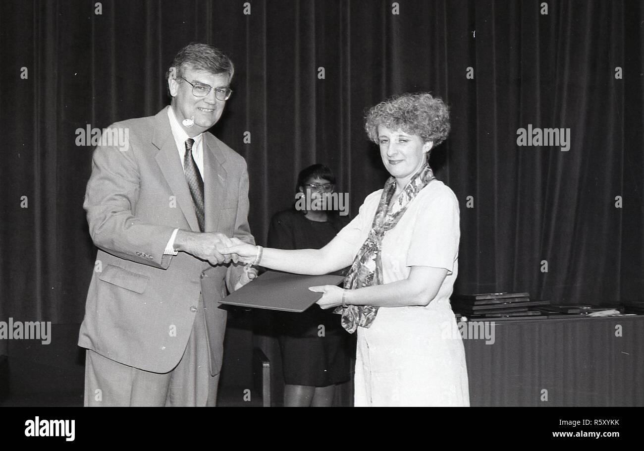Admin. Atwood presenting general awards - Woman receiving award on ...