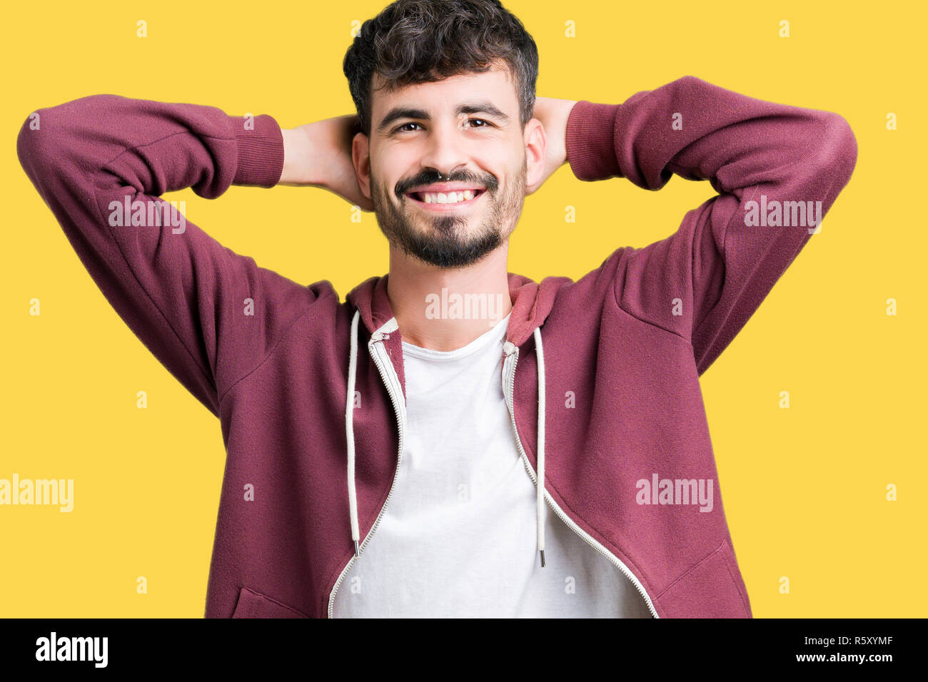 Young handsome man over isolated background Relaxing and stretching ...