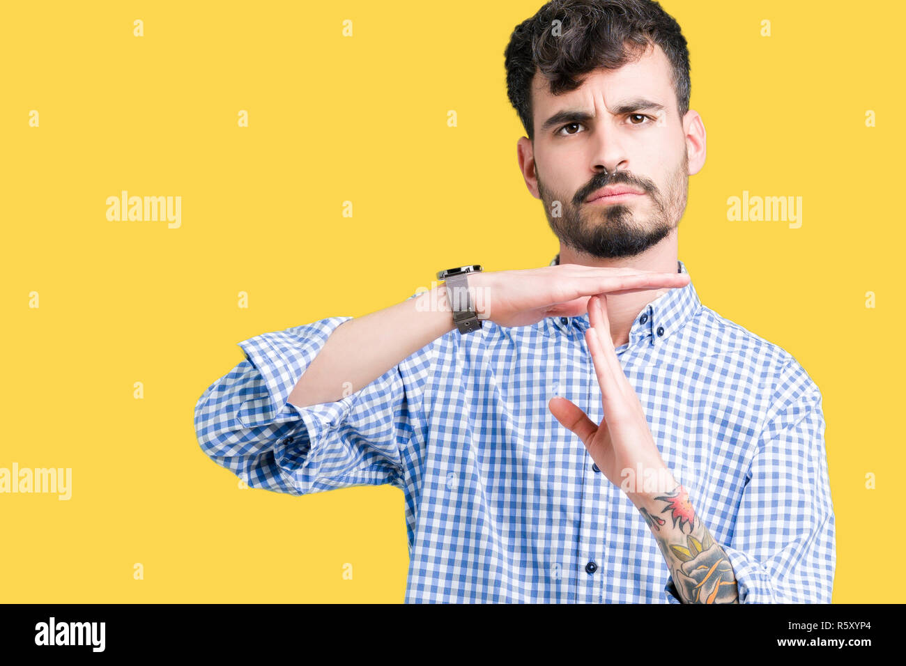 Young handsome business man over isolated background Doing time out ...