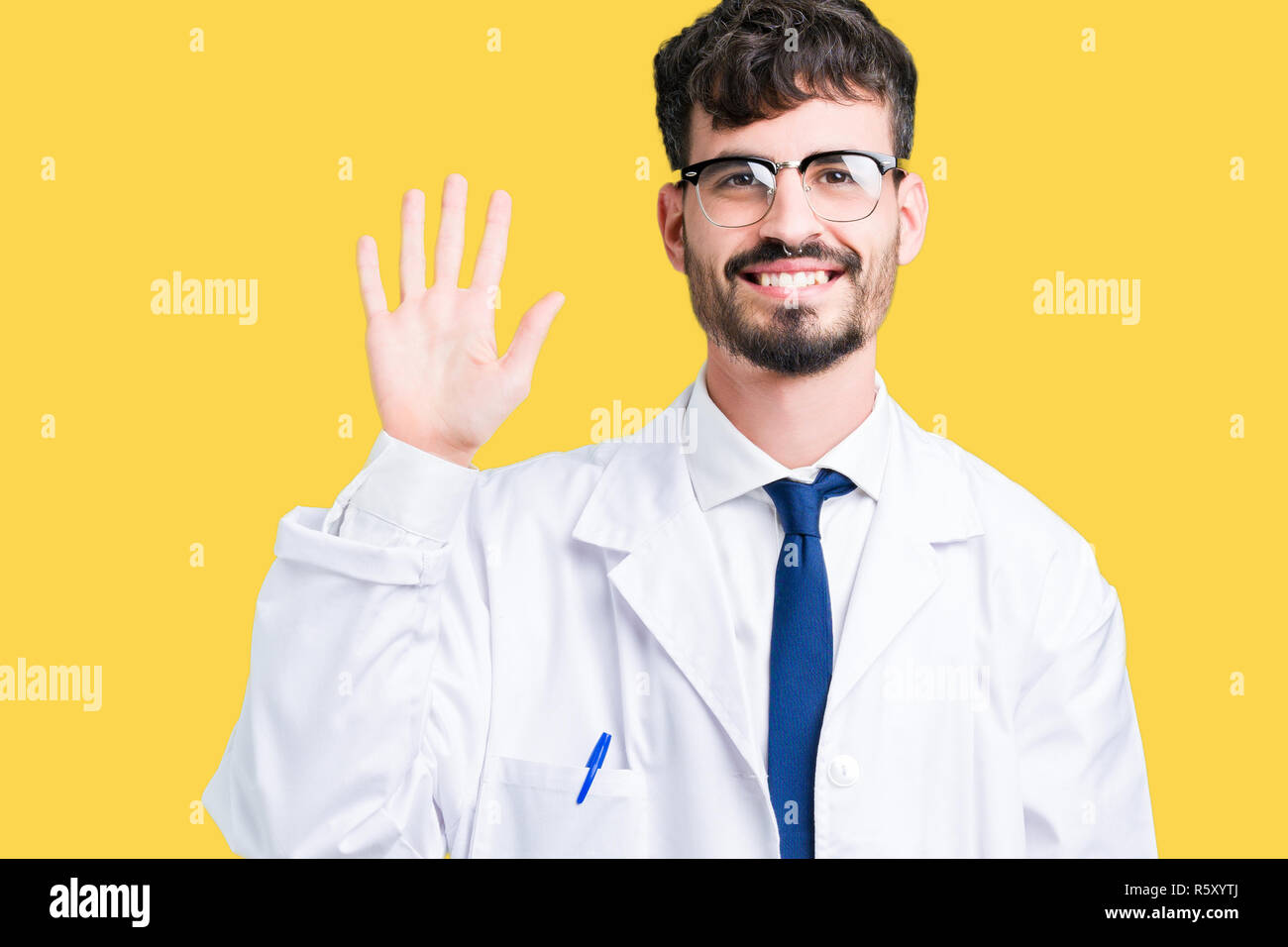 Young professional scientist man wearing white coat over isolated ...