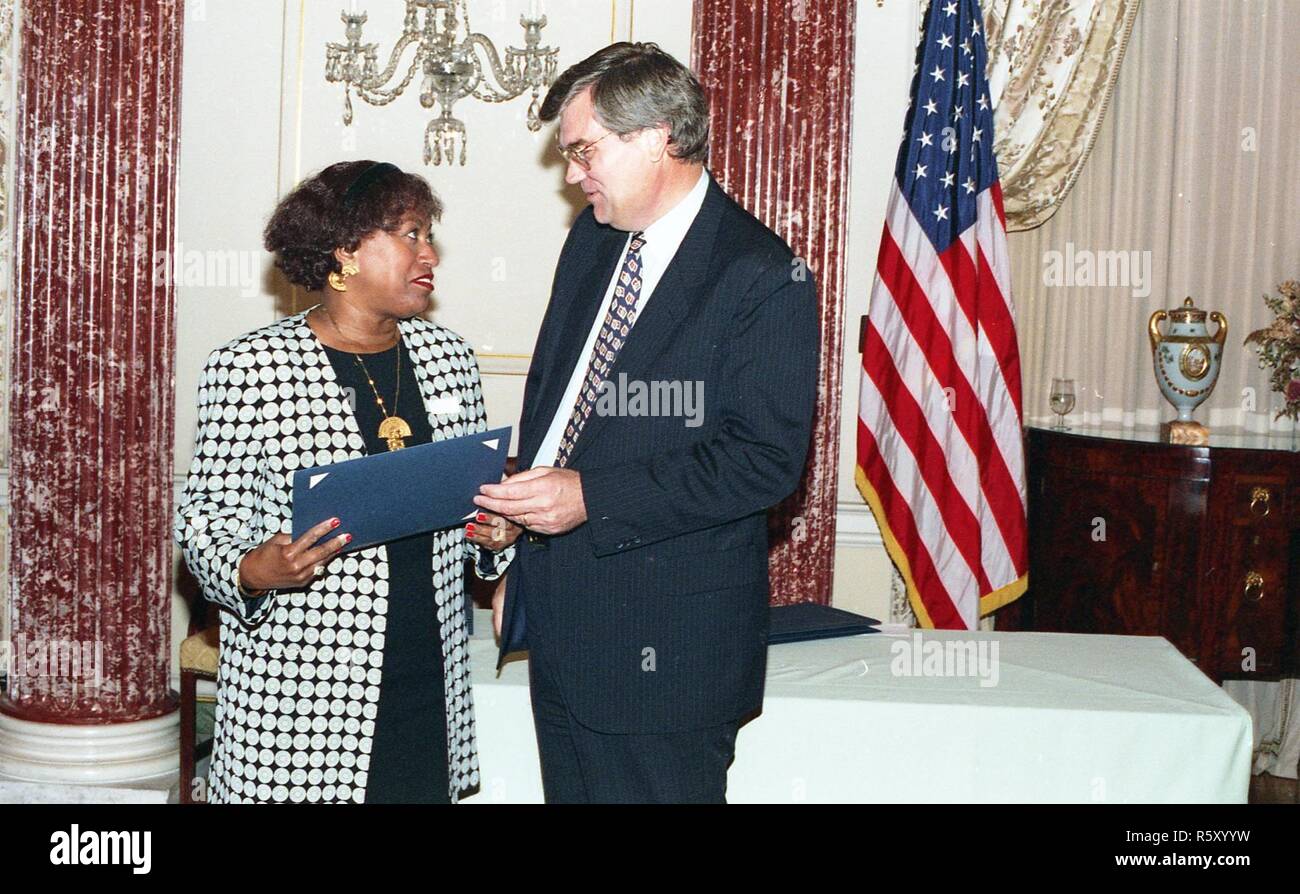 woman accepting award taking a picture Stock Photo - Alamy