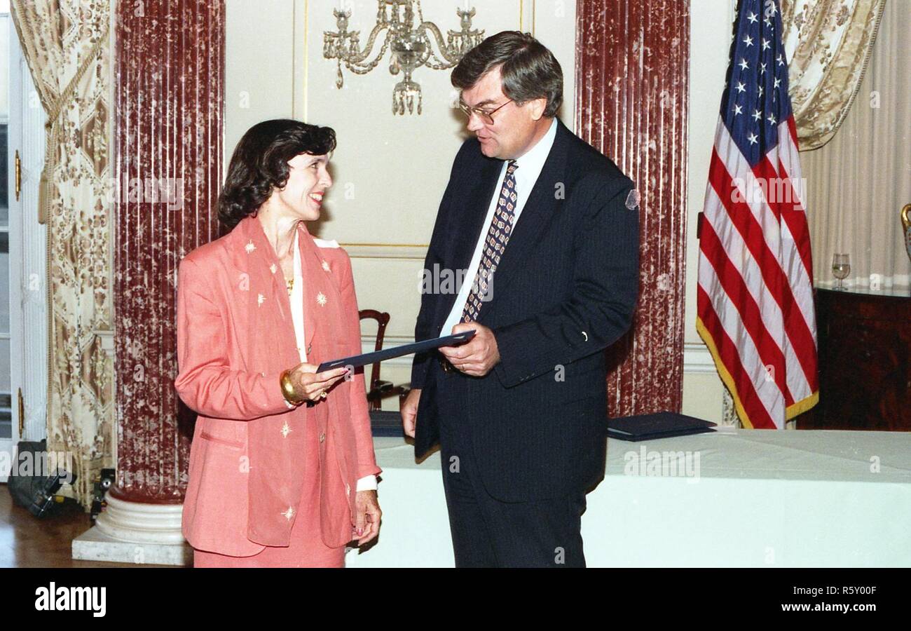 woman accepting award taking a picture Stock Photo - Alamy