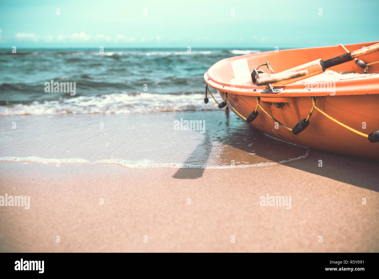 Orange lifeguard rescue boat Stock Photo - Alamy