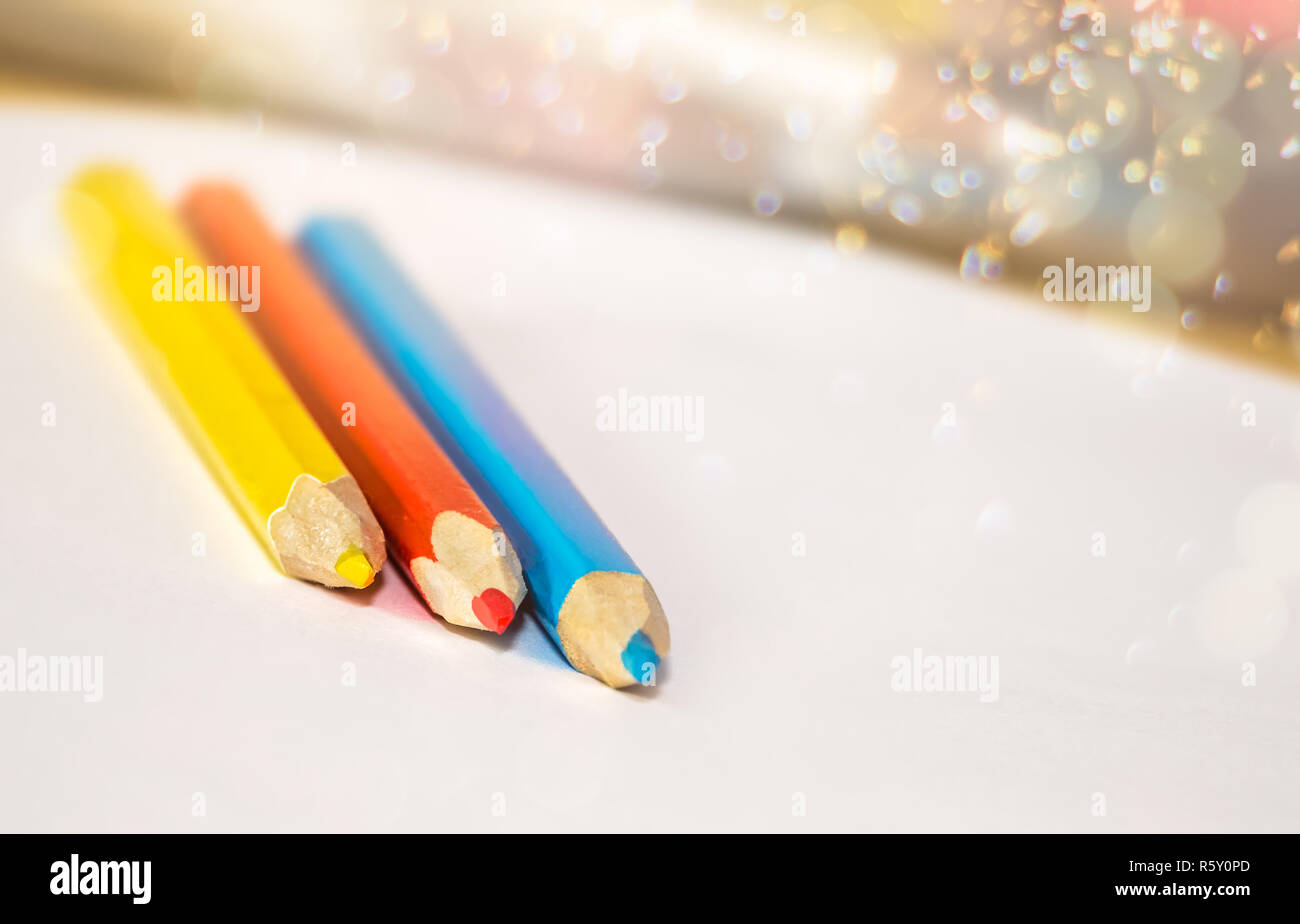 Colorful crayons on white paper Stock Photo - Alamy