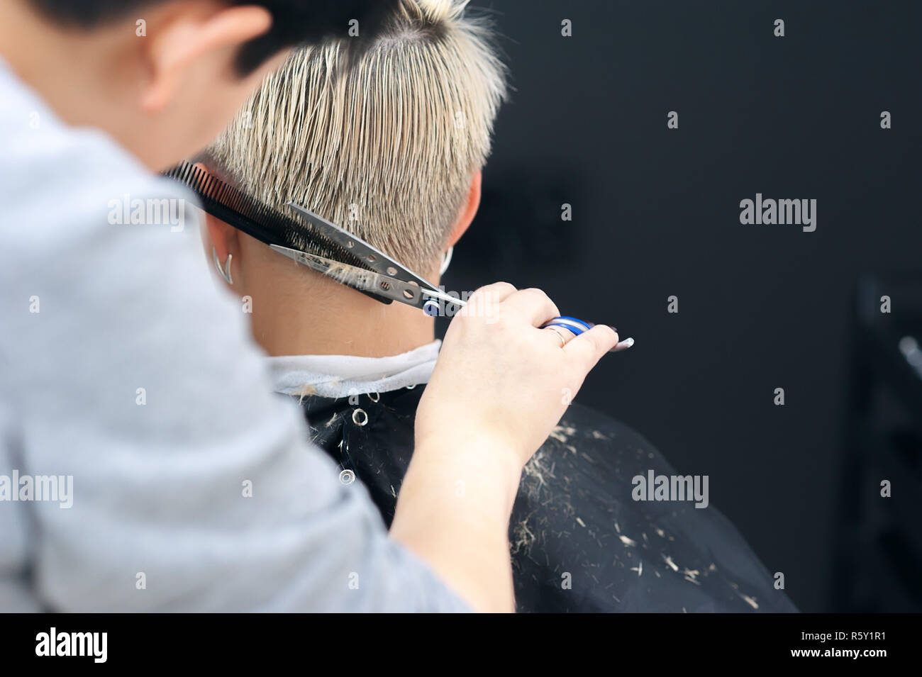 Women's haircut. Hairdresser, beauty salon. Professional hairdresser ...