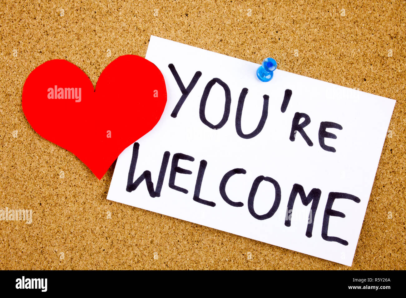 A yellow sticky note writing, caption, inscription You are welcome ...