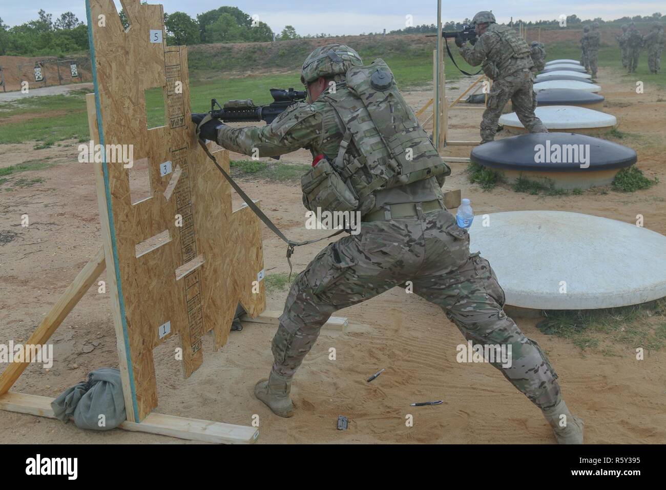 An 82nd Airborne Division first sergeant engages targets during the ...