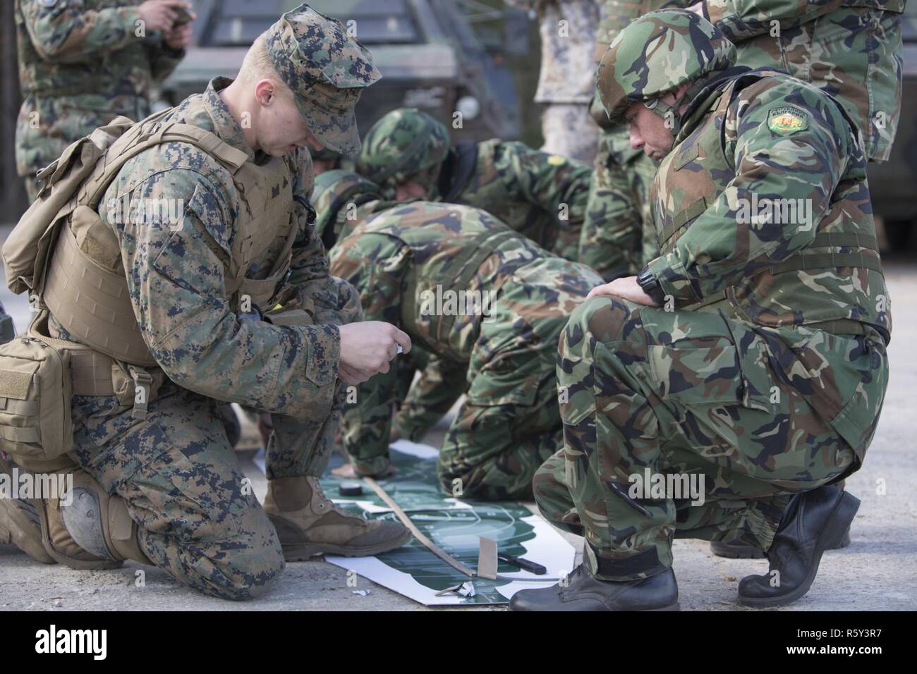 A U.S. Marine with Black Sea Rotational Force 17.1 teaches a Bulgarian ...