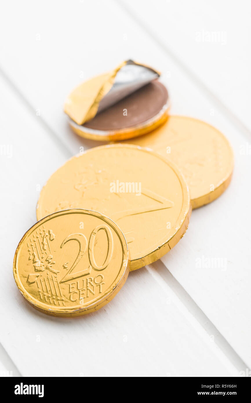 Gold foil wrapped chocolate coin hi-res stock photography and images ...