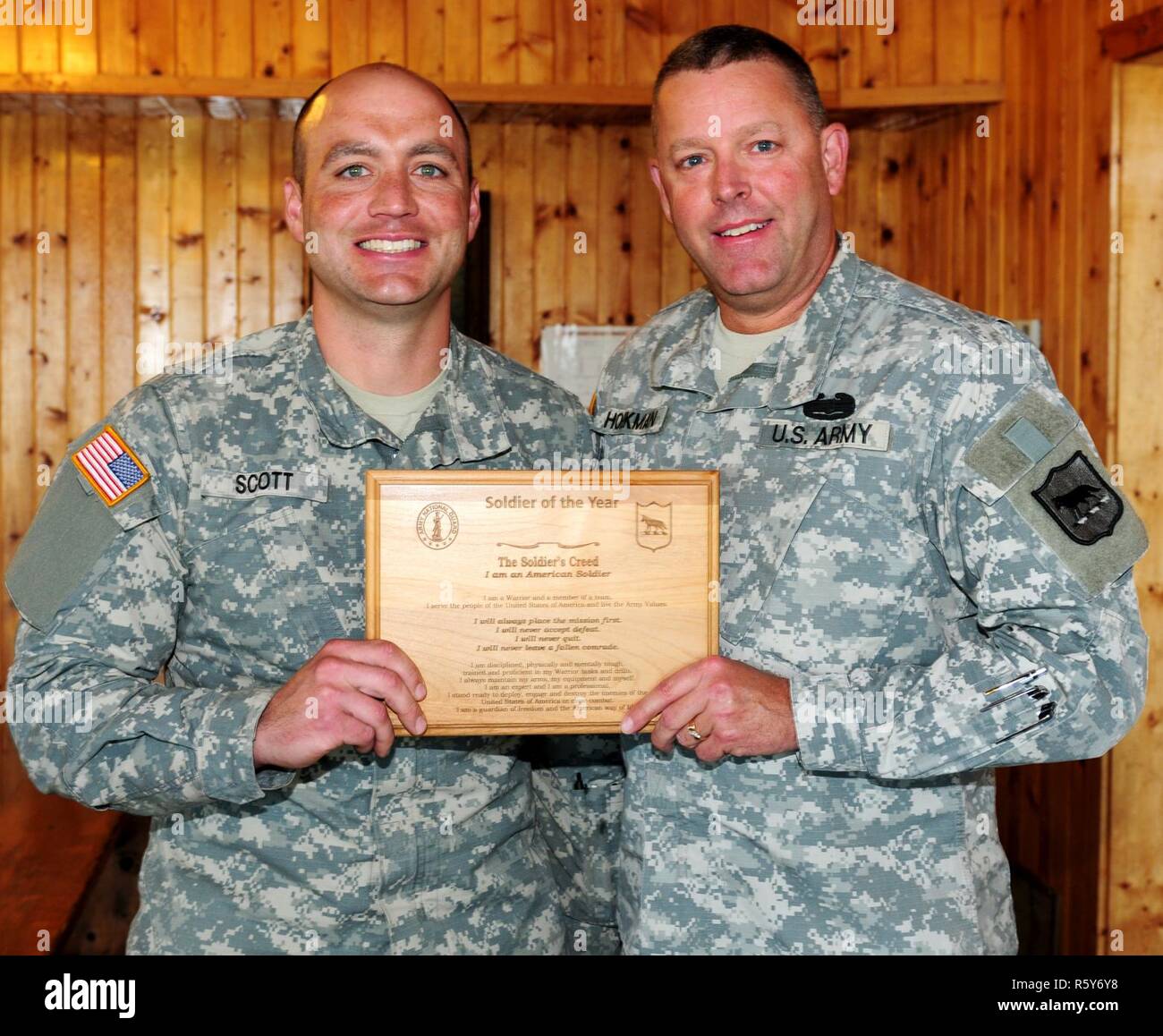 U.S. Army Spc. Lucas Scott, left, 842nd Engineer Company, South Dakota ...