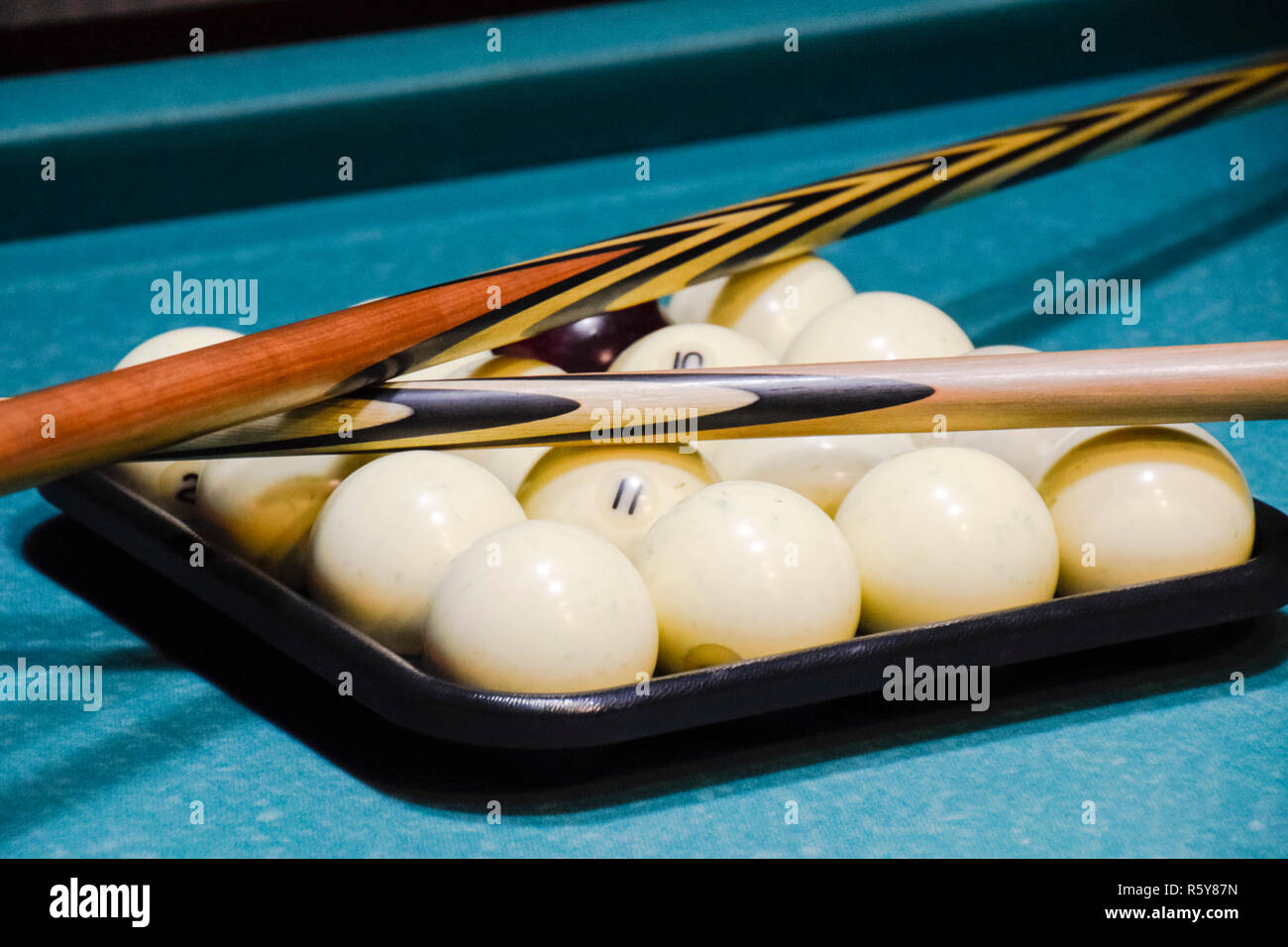 Billiards, billiard table, balls and cue. Balls in the tray and Stock ...